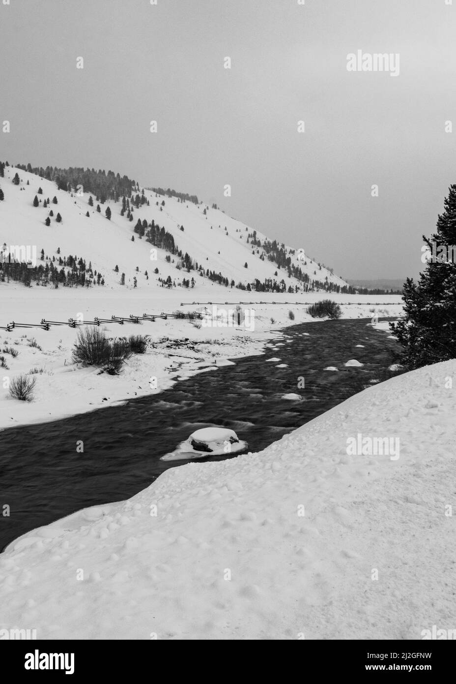 River runs through snow in the Sawtooth National Recreation Area ...