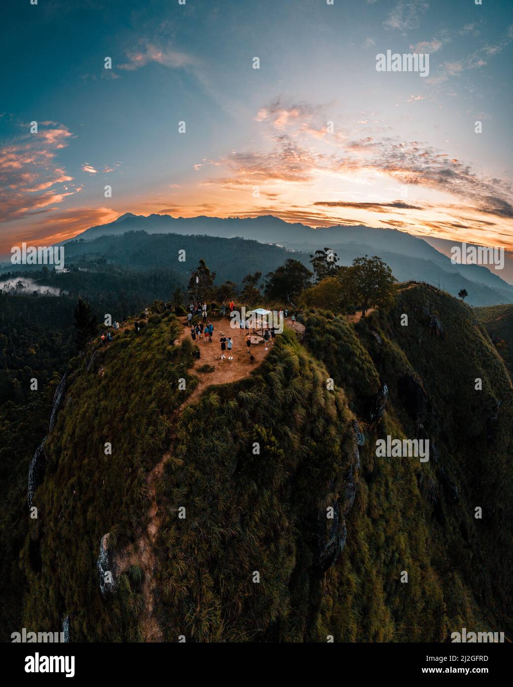 A vertical aerial drone shot of Little Adams Peak during sunrise in Sri ...