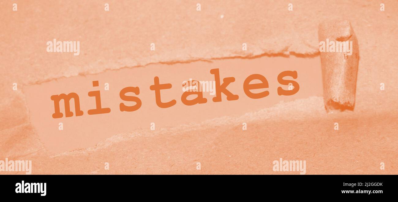 Torn paper with text MISTAKES, business concept Stock Photo - Alamy
