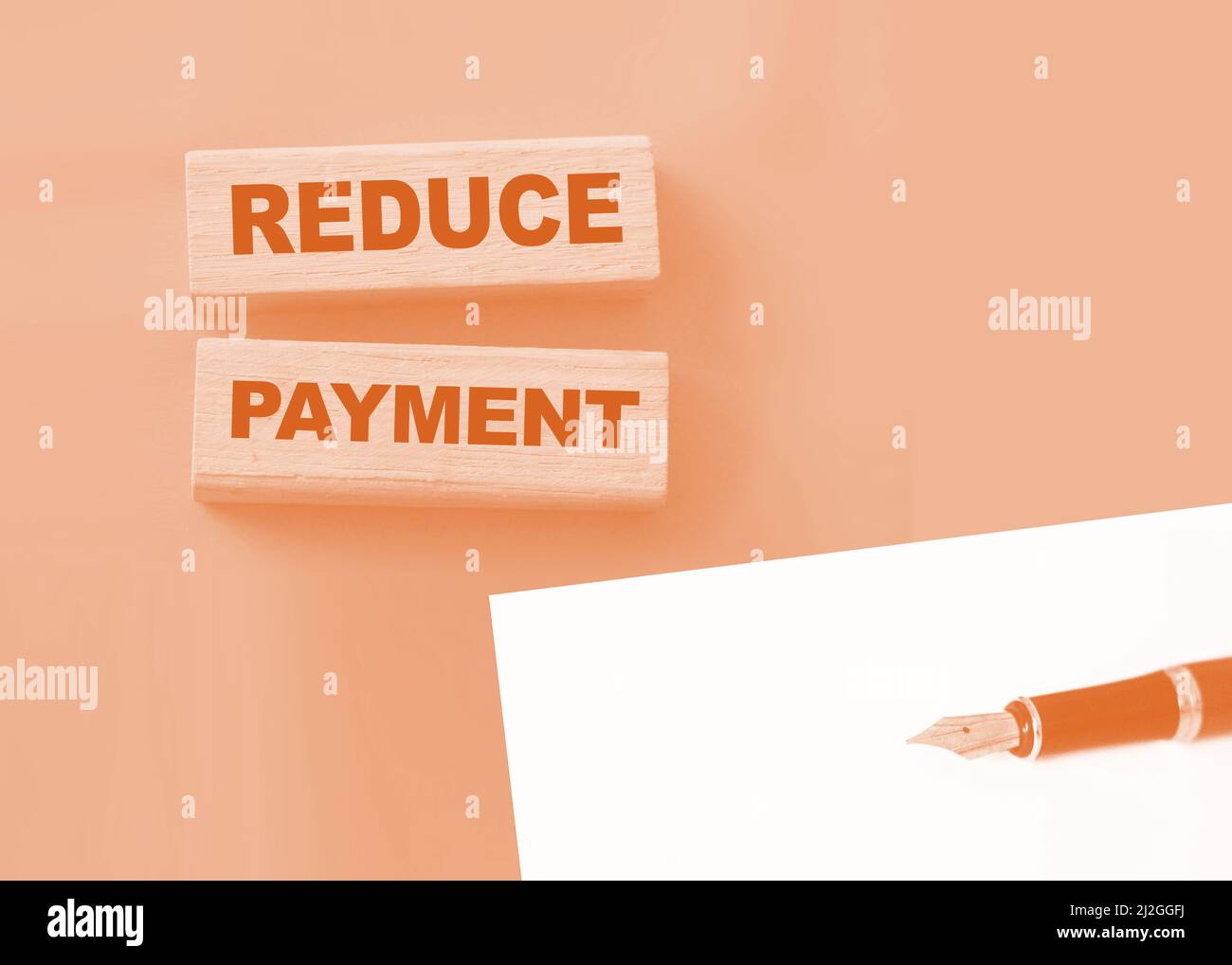 Wooden blocks with the words Reduce payment. Business concept Stock ...