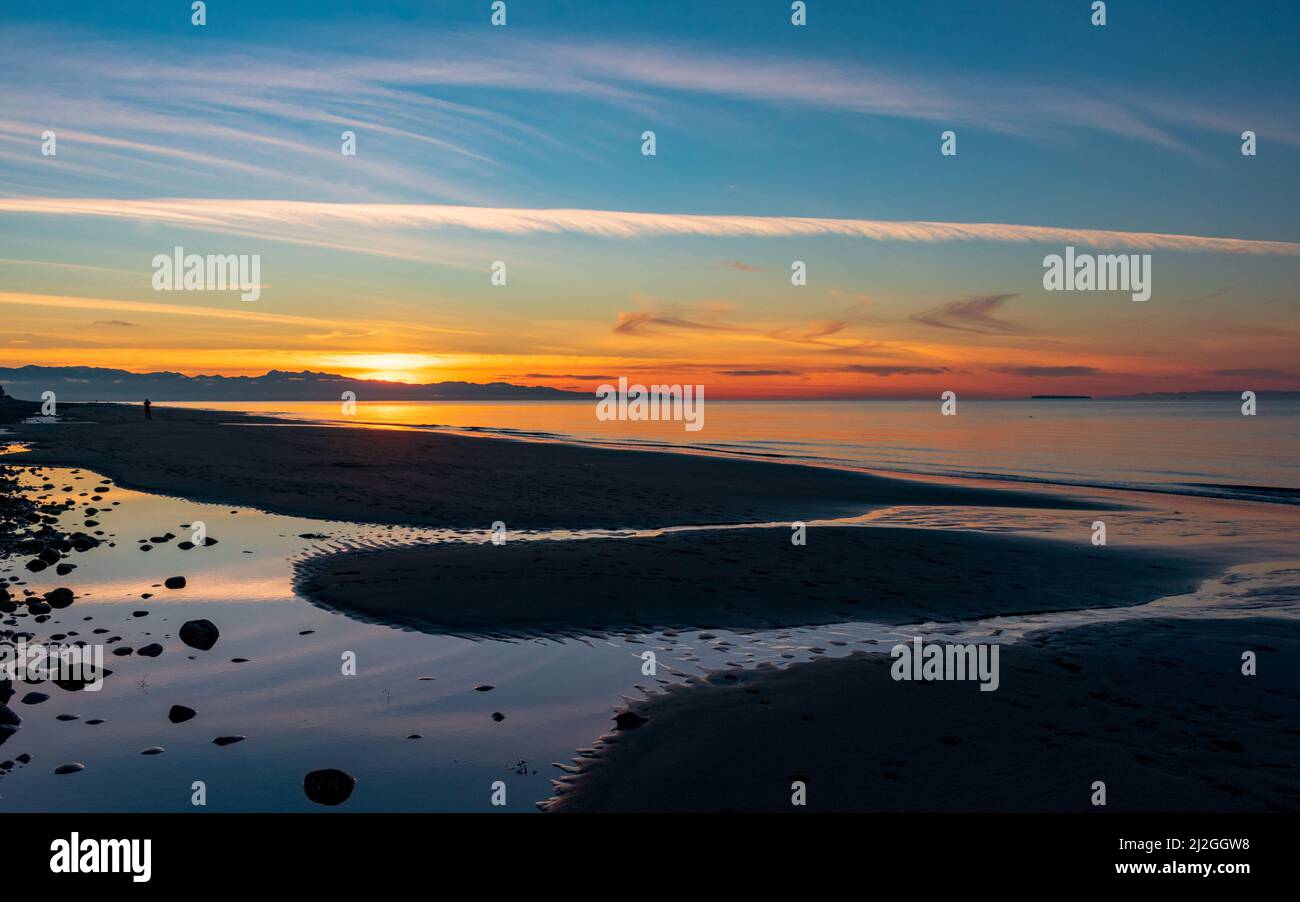 Sunset colors reflect on beach, Whidbey Island, Washington Stock Photo ...
