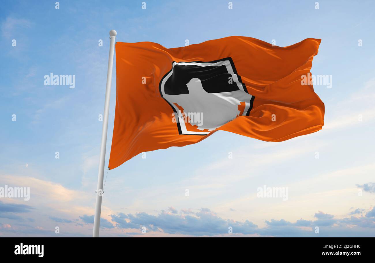 flag of divinopolis , Brazil at cloudy sky background on sunset ...