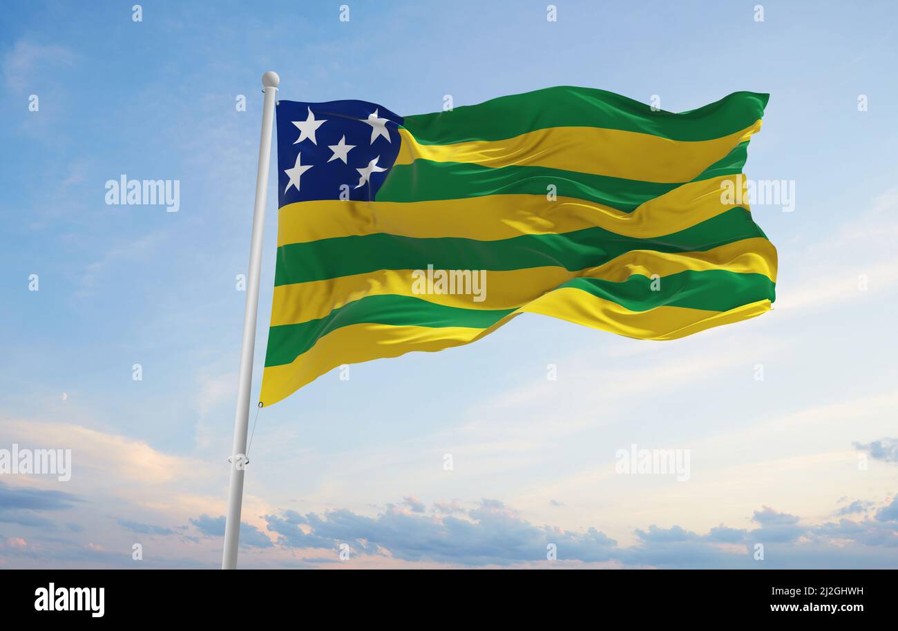 flag of Goias , Brazil at cloudy sky background on sunset, panoramic ...