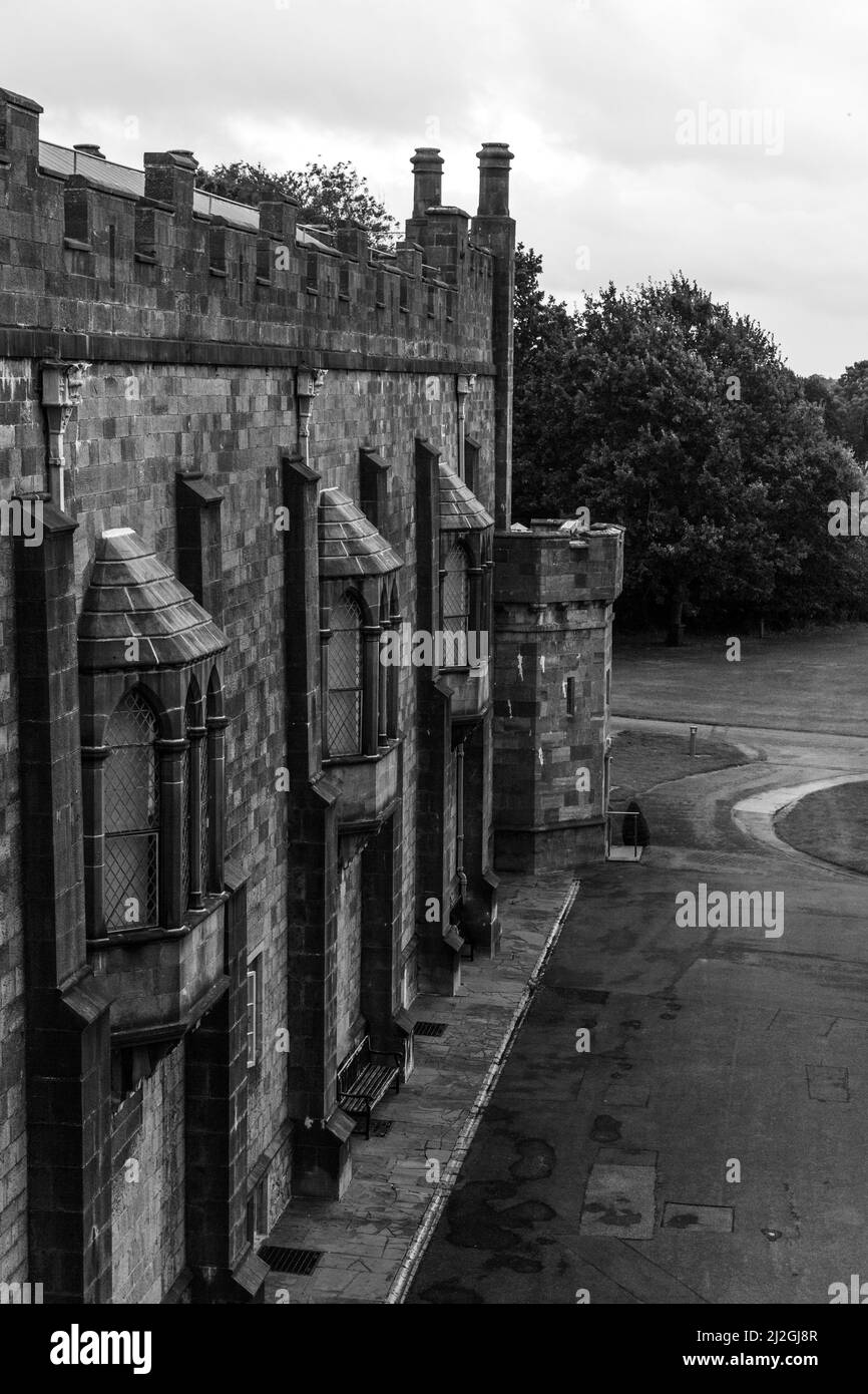 A greyscale shot of a castle stone wall buttress Stock Photo - Alamy