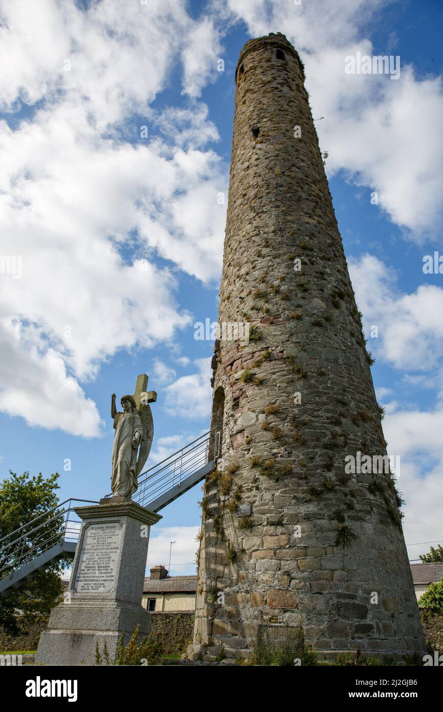 A granary tower on church grounds, cemetery, and gravestones Stock ...