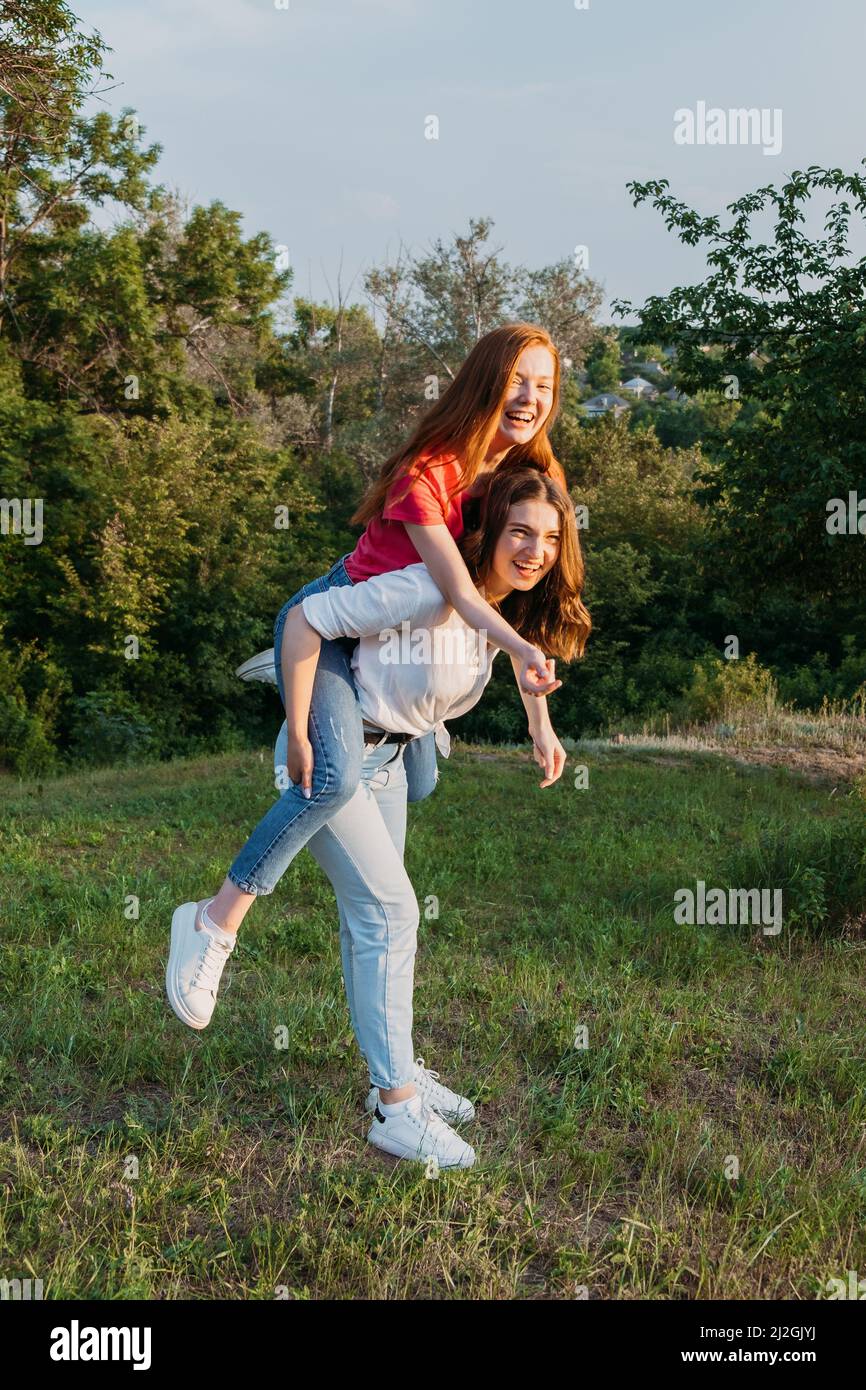 Two Happy Cheerful Young Loving Girl Friends Having Fun On Nature Background Two Friends Gen Z