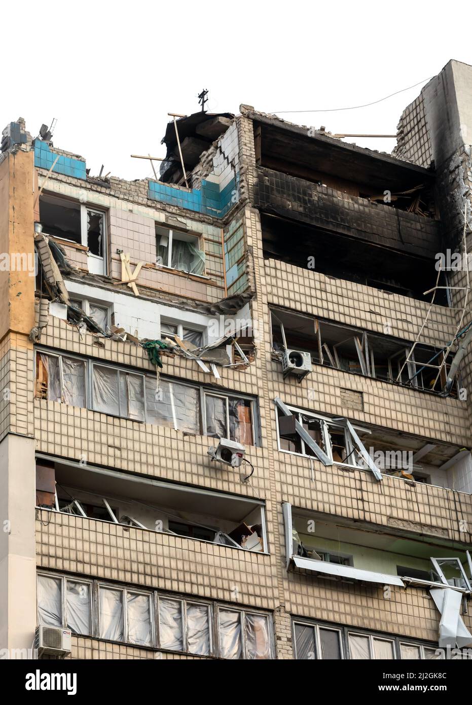 Ruined apartment and broken windows on a residential building damaged ...