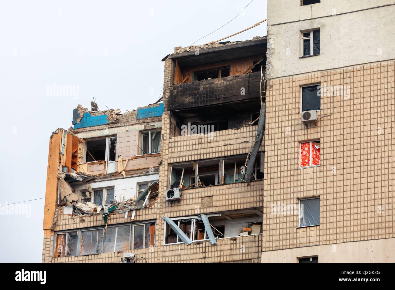 Ruined apartment and broken windows on a residential building damaged ...