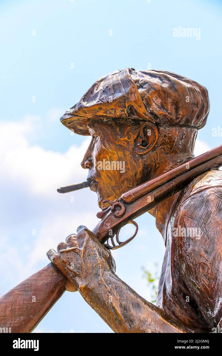 2021 07 20 Tulsa OK USA Side view of bronze statue of man with cigar ...