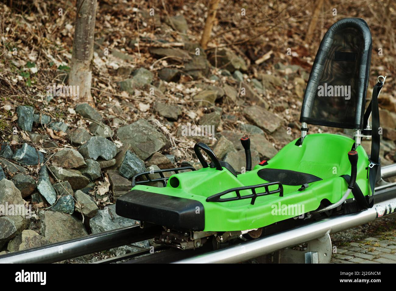 Electric green sleigh ride on rails Stock Photo - Alamy