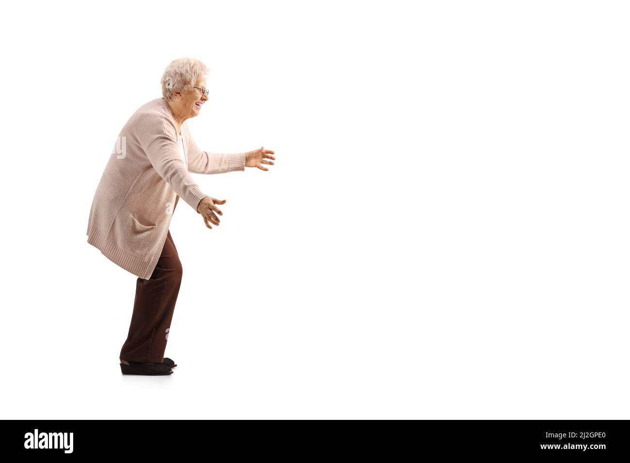 Full length profile shot of an elderly woman waiting with arms wide ...