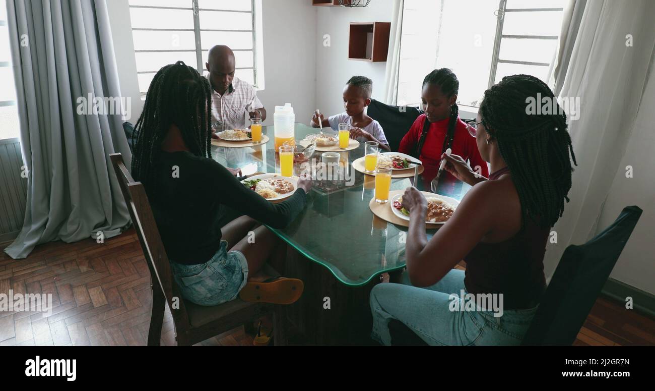 African family at lunch table eating Stock Photo - Alamy