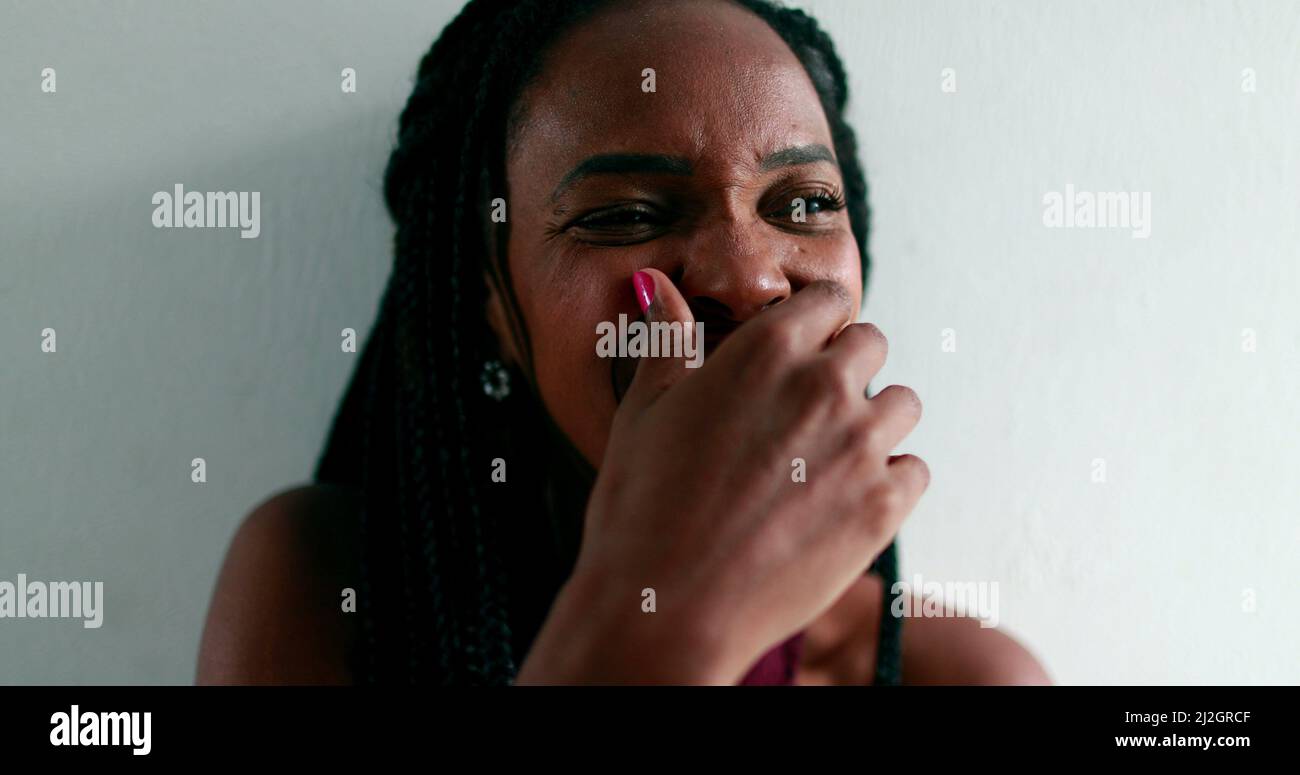 African woman laughing spontaneously, real life authentic laugh and ...