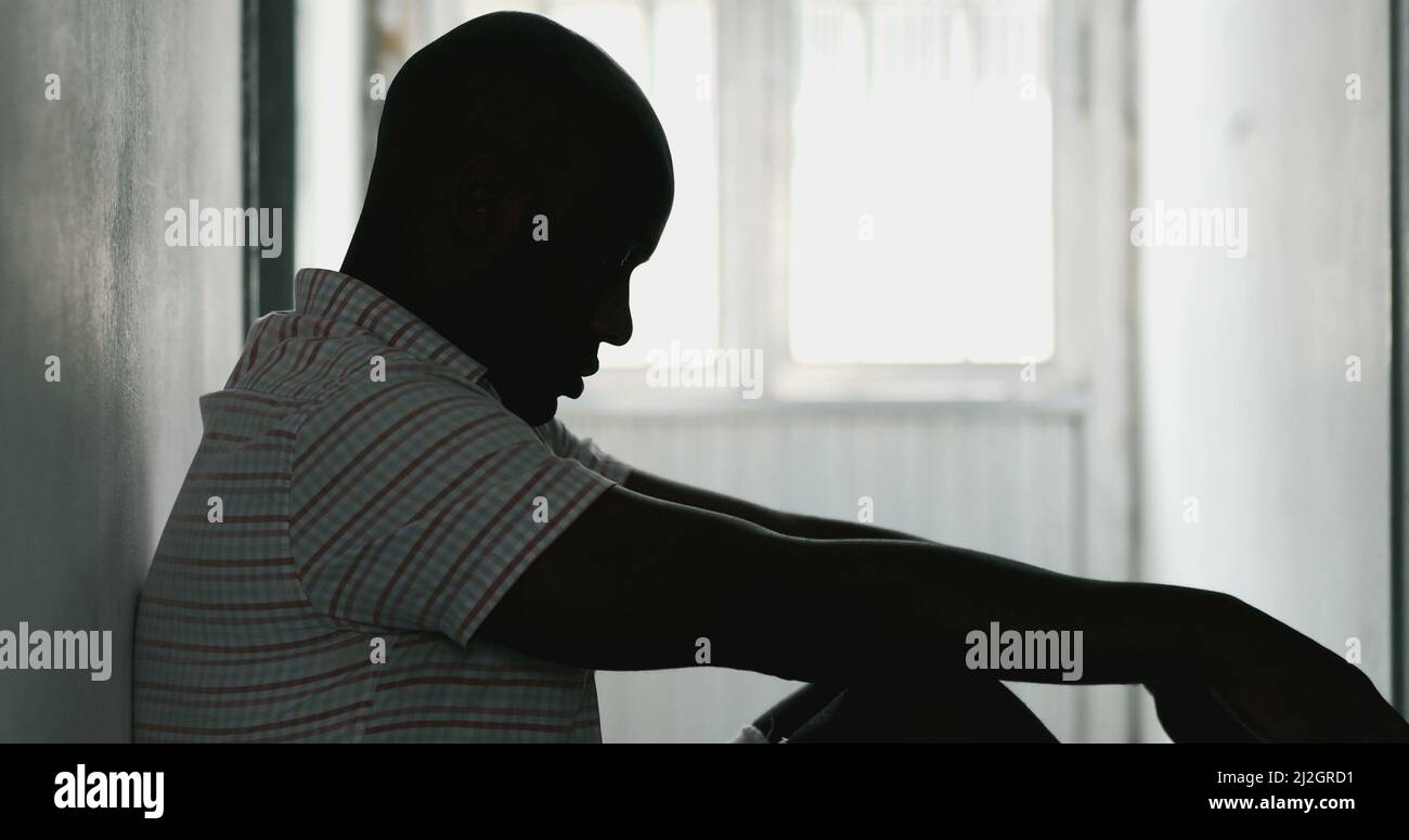 African man seeking God help and guidance, raising arms in air during ...