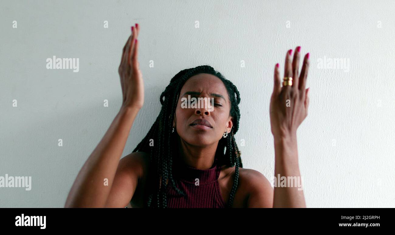 Black woman praying to God, african female raising arms to sky seeking ...