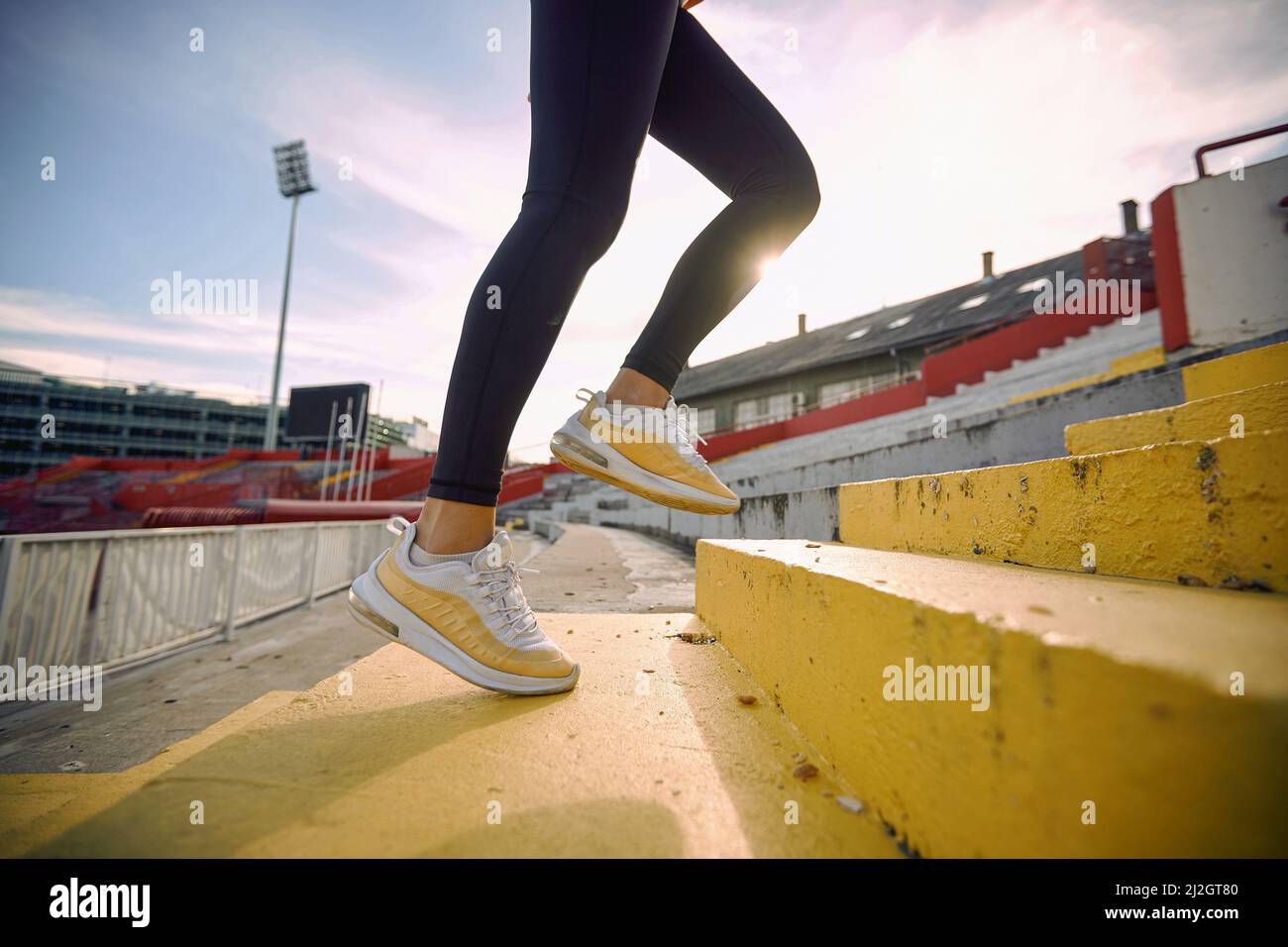 Female working out alone outside on the stairs Stock Photo - Alamy