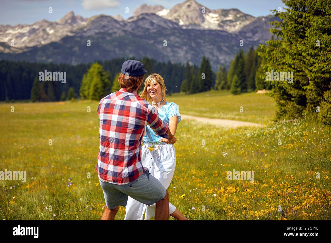 A young couple having a good time on a beautiful sunny day in the ...