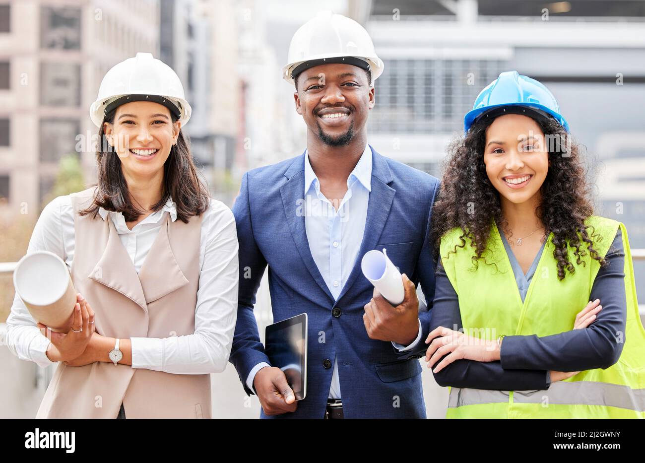 Were here to build. Cropped portrait of three young engineers standing ...