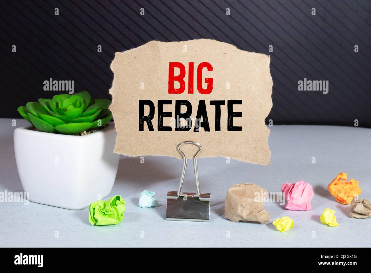 On a light background - cash, a white calculator and a yellow sticker ...