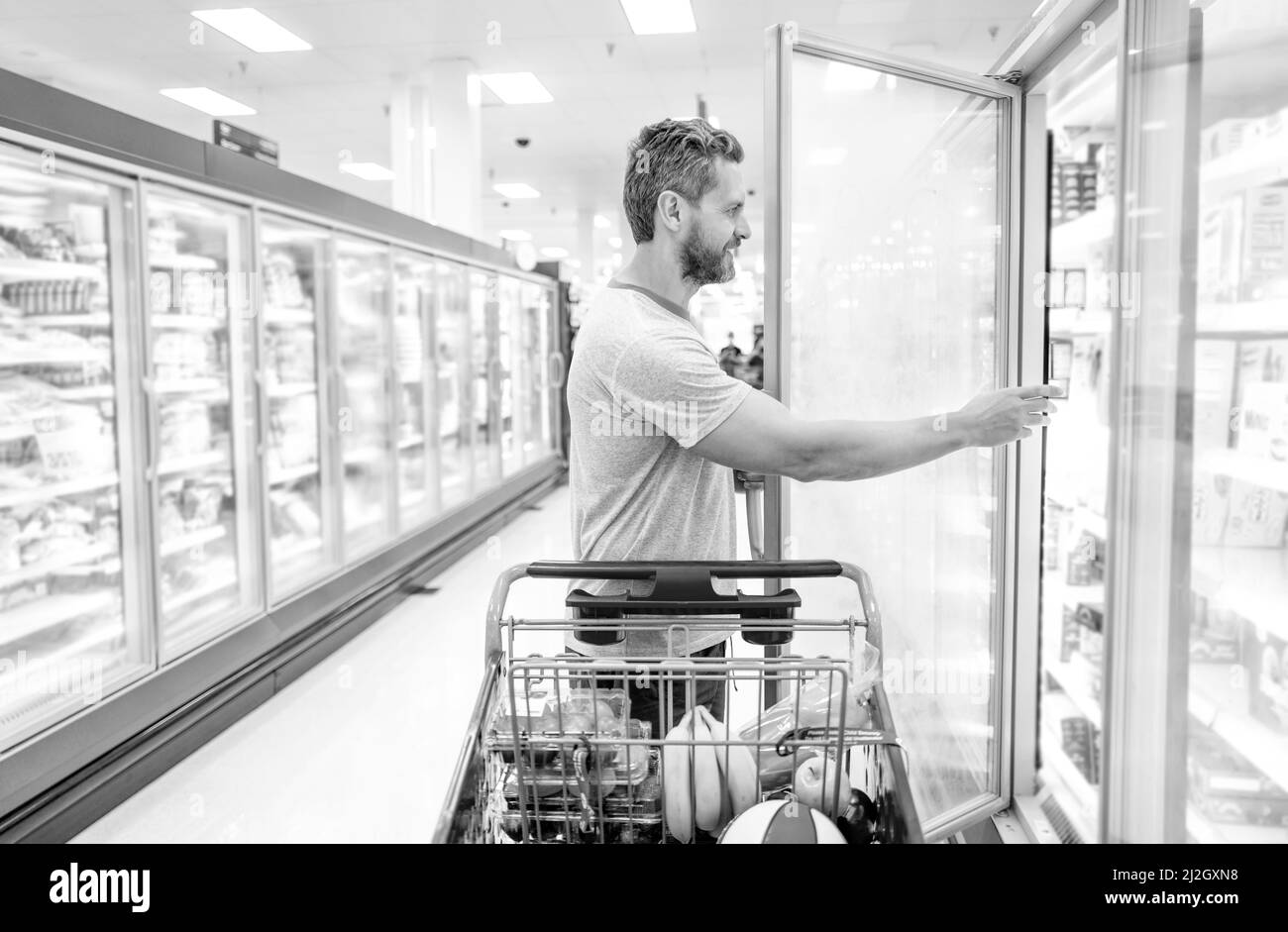 happy man with shopping cart. customer consumer with purchases. guy at ...