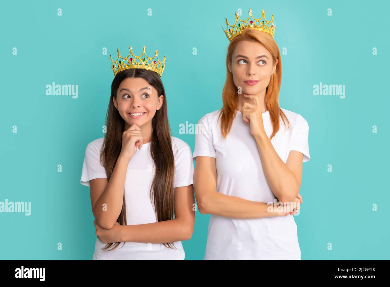 Being in doubt. Selfish mother and daughter child with pensive smile ...