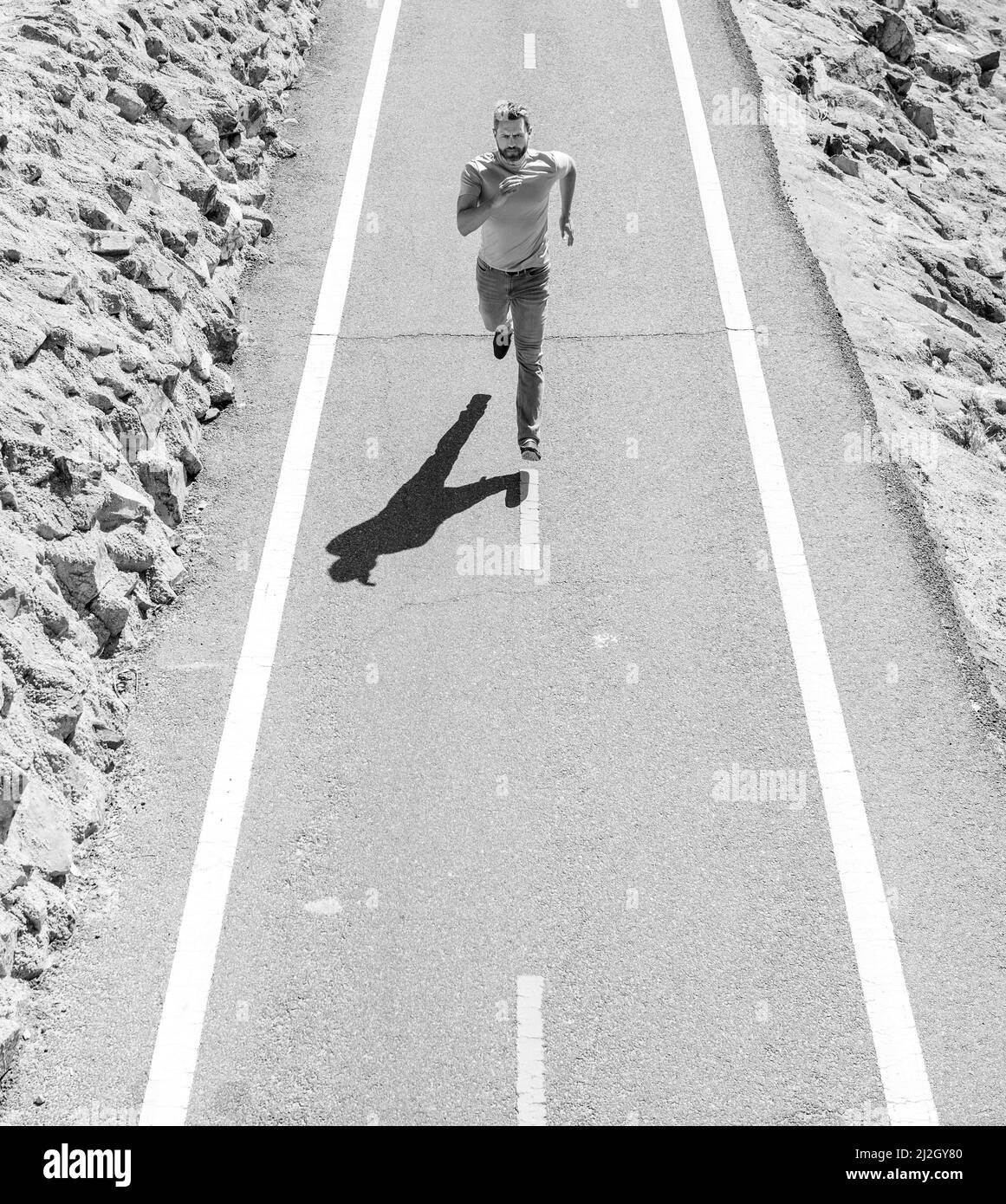 Athletic man runner sprinting Black and White Stock Photos & Images - Alamy