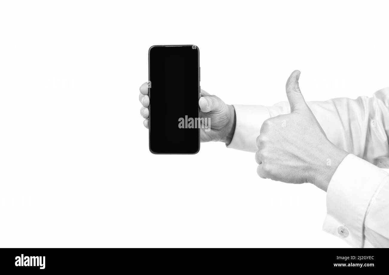 mobile phone screen copy space in male hand showing thumb up isolated ...