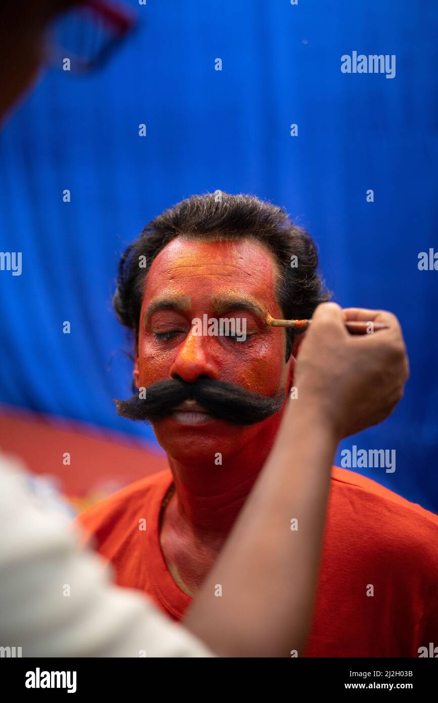 Make-up artist working to transform a man to the avatar of Virabhadra ...