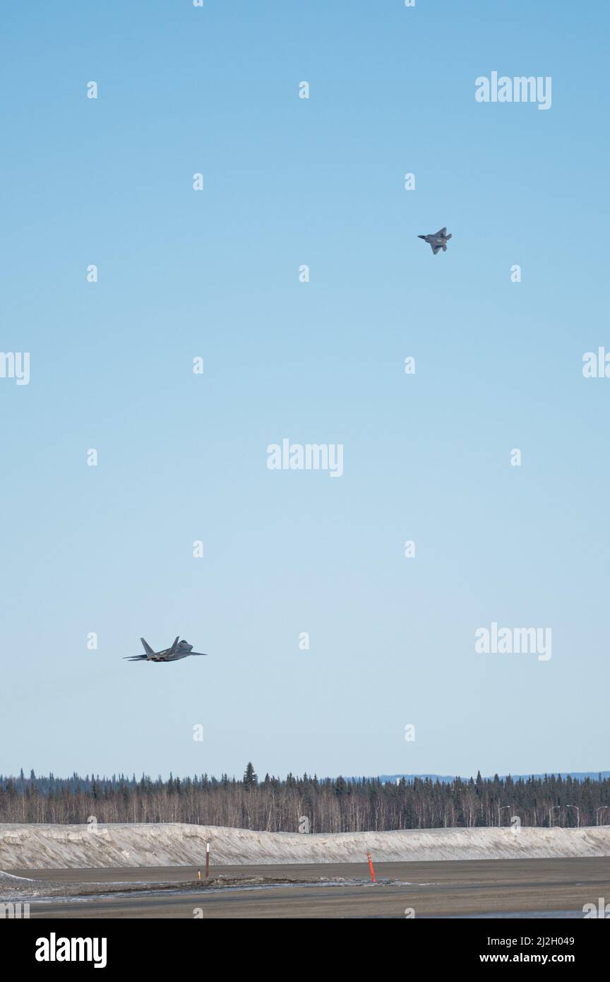 Two U.S. Air Force F-22 Raptors assigned to the 3rd Wing, Joint Base ...