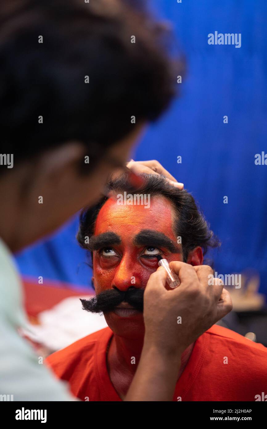 Make-up artist working to transform a man to the avatar of Virabhadra ...