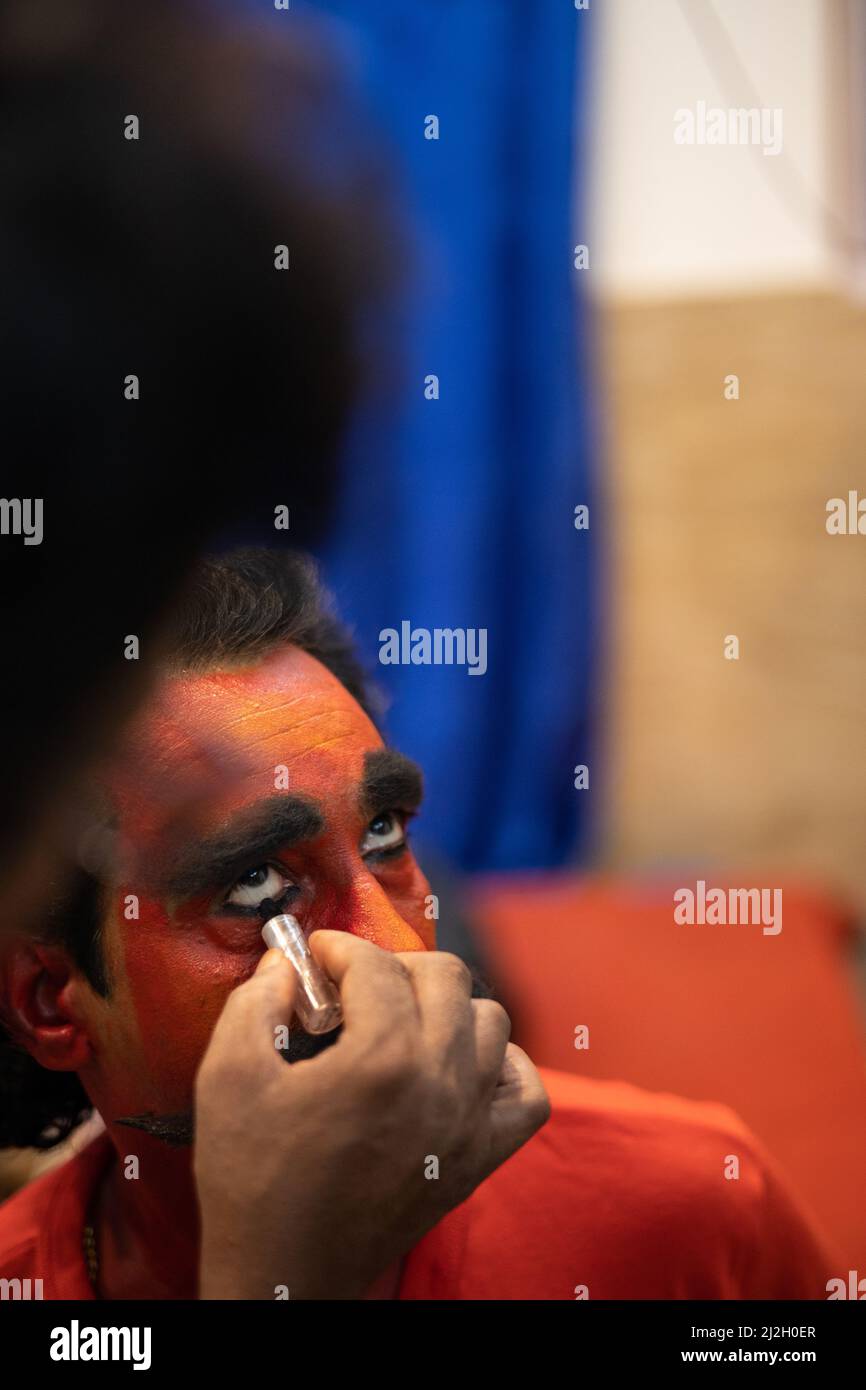 Make-up artist working to transform a man to the avatar of Virabhadra ...