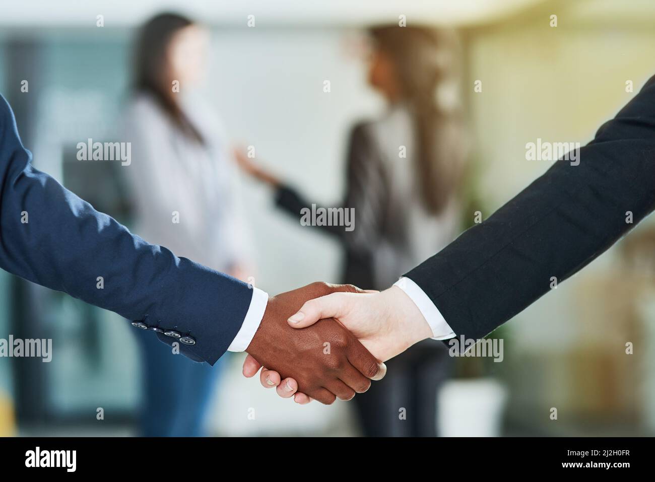 Coming to an agreement. Shot of businesspeople shaking hands Stock ...