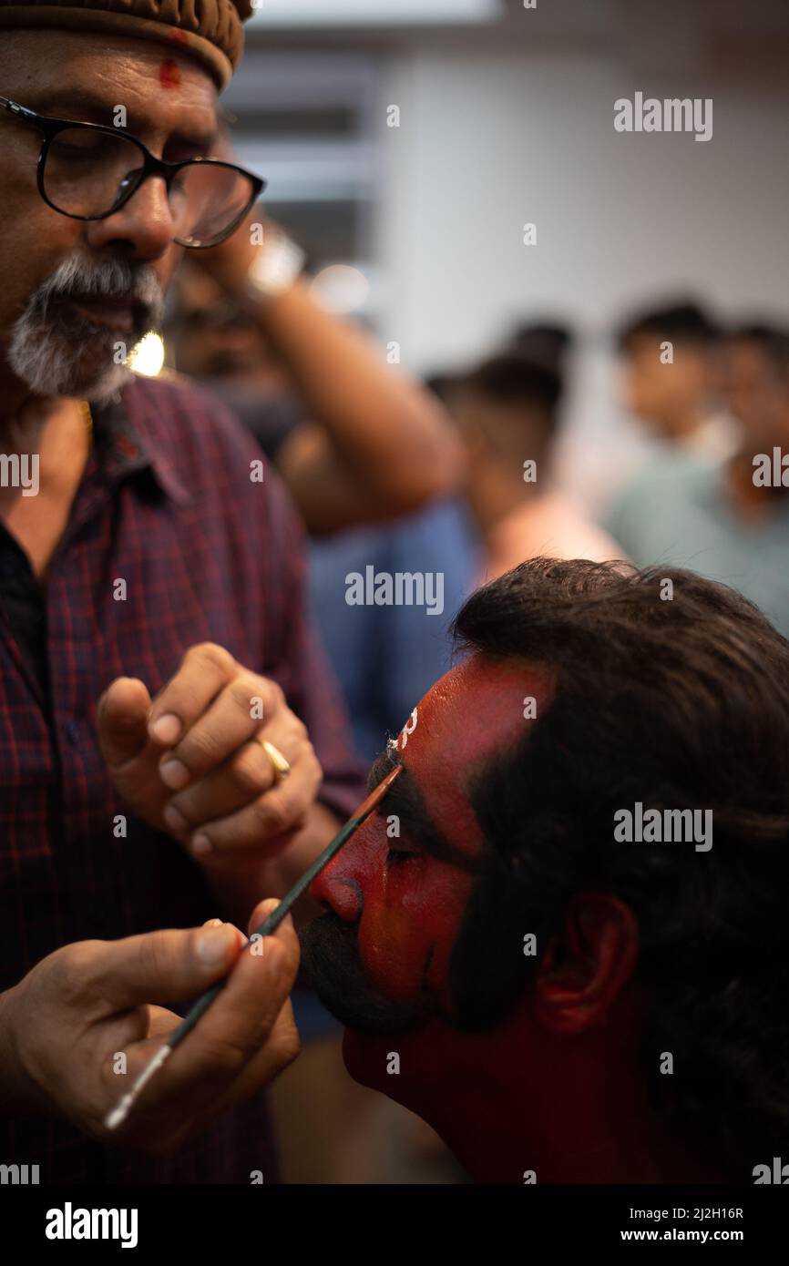Make-up artist working to transform a man to the avatar of Virabhadra ...