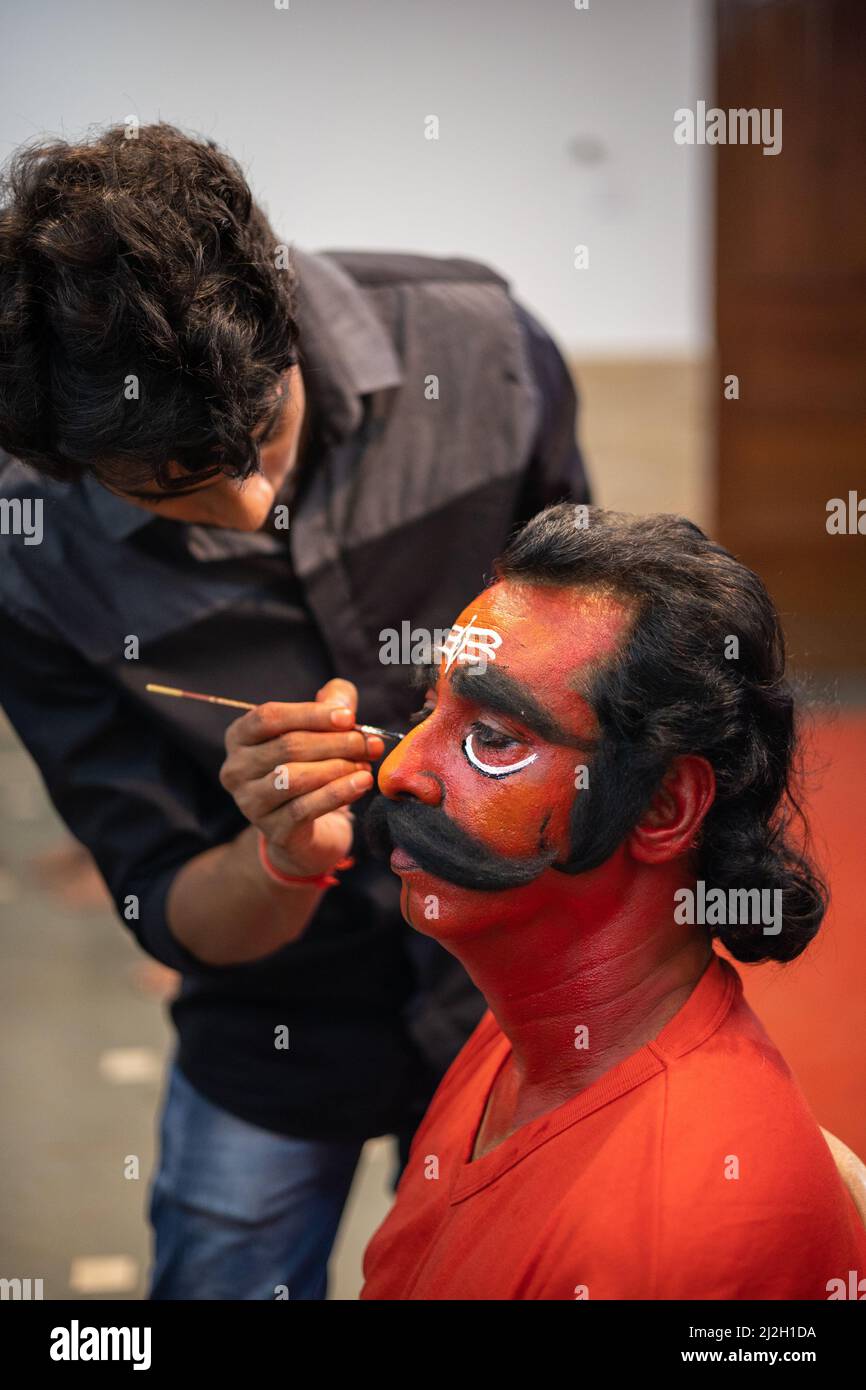 Make-up artist working to transform a man to the avatar of Virabhadra ...