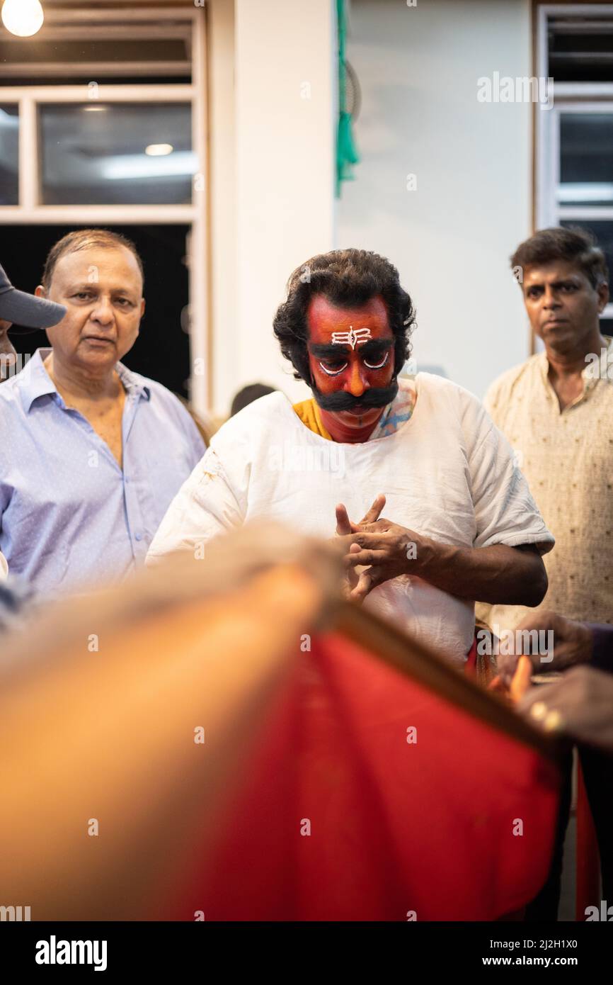 Men helping to dress up Virabhadra for the folk dance performance at ...