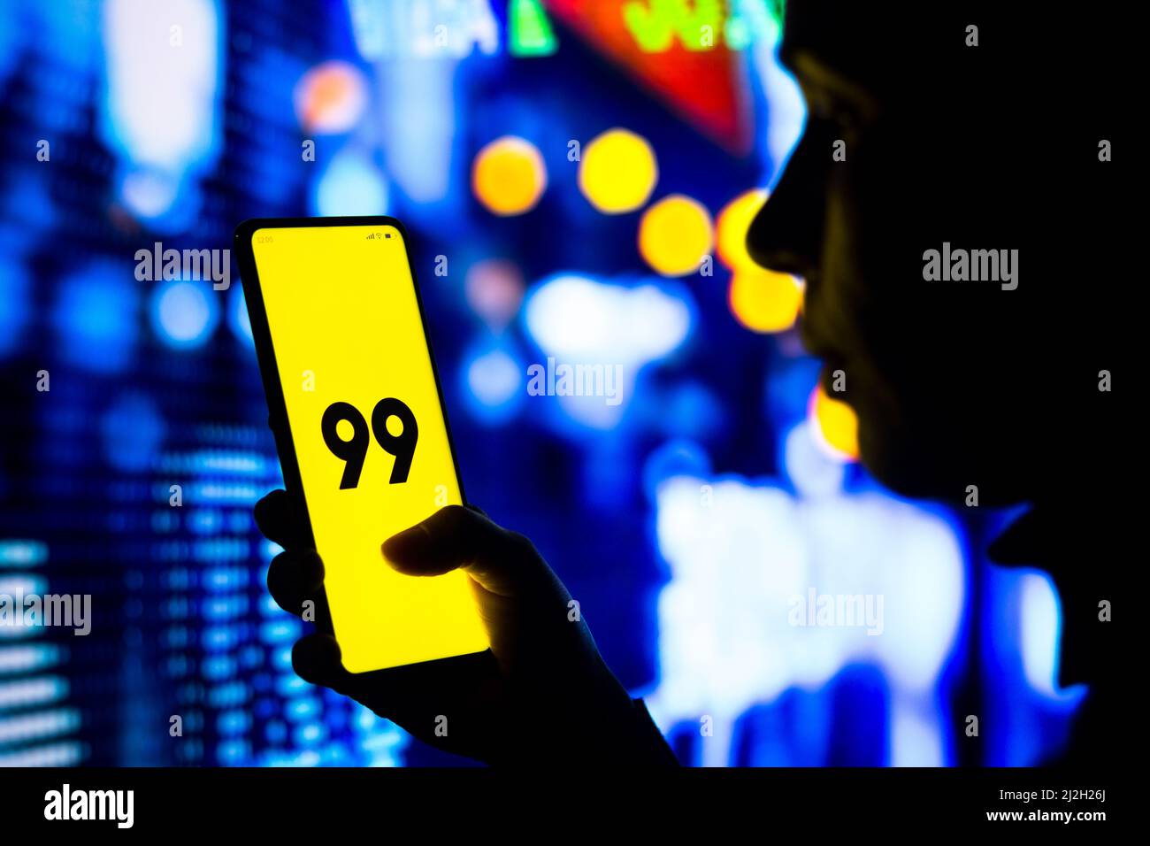 In this photo illustration, a woman's silhouette holds a smartphone ...