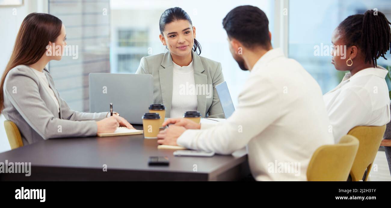 Individual commitment to a group effort. Shot of a group of ...