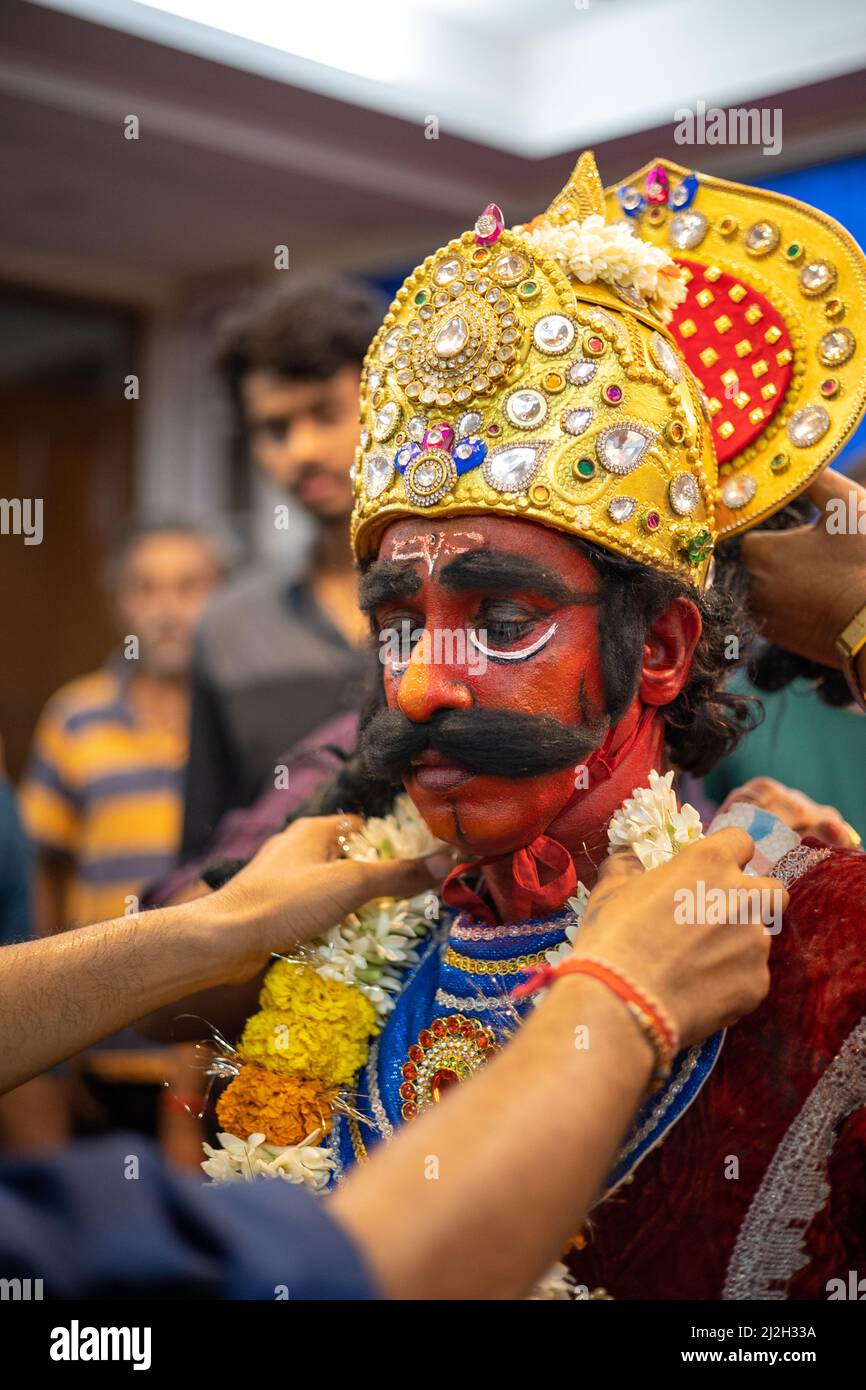 People putting a garland around Virabhadra as he gets ready for the ...