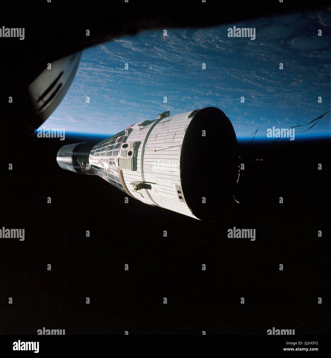 This photograph of the Gemini 7 spacecraft was taken from Gemini 6 ...
