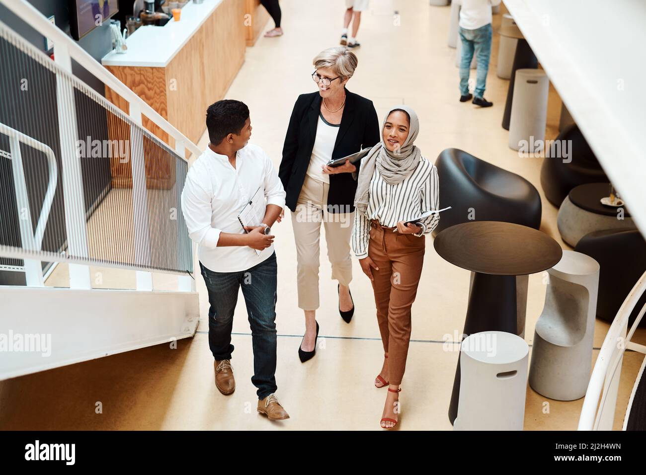 Smiling employee walking in high hi-res stock photography and images ...