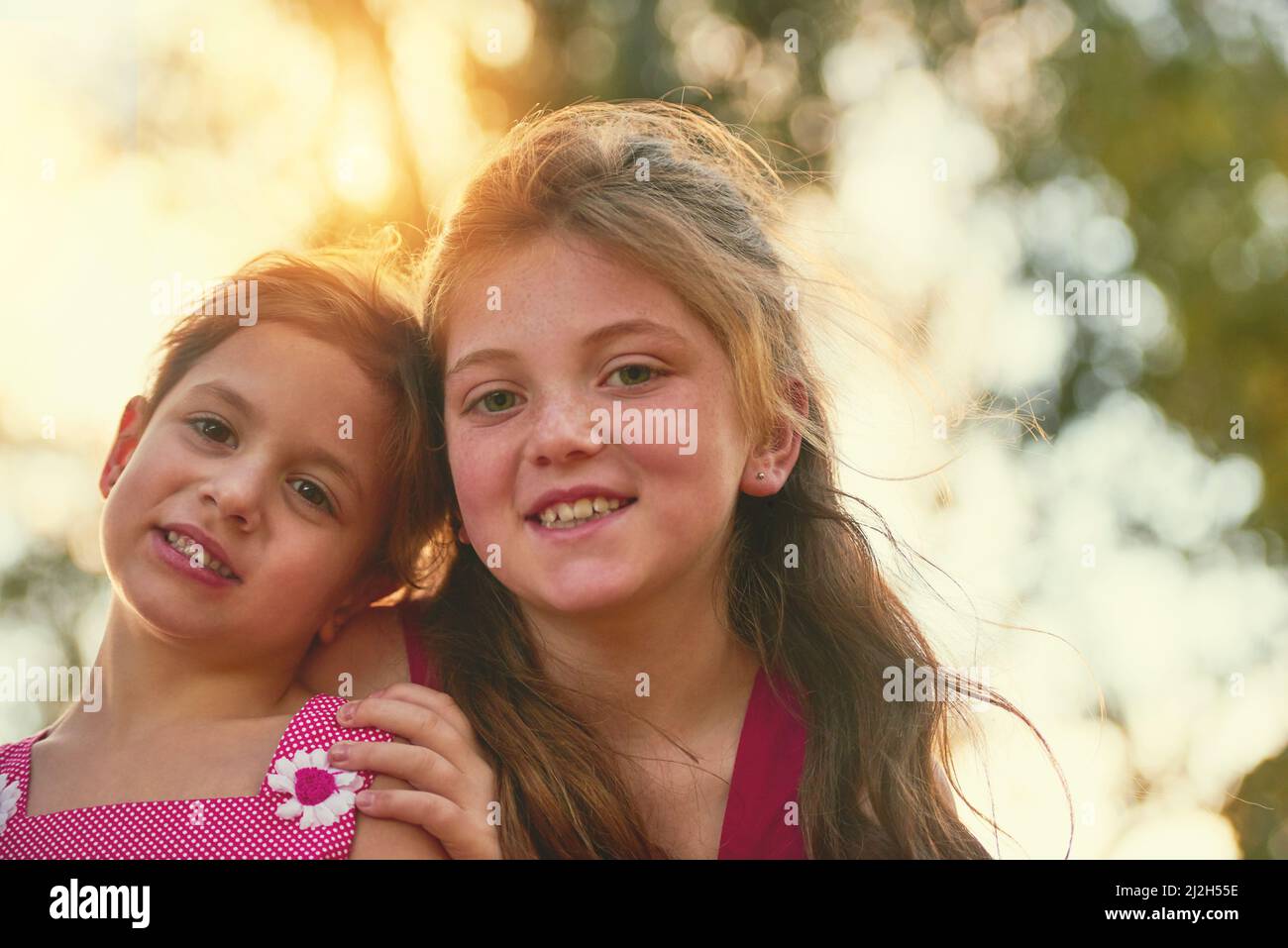 Two Sisters One Soul Portrait Of Two Cute Sisters Playing Together In