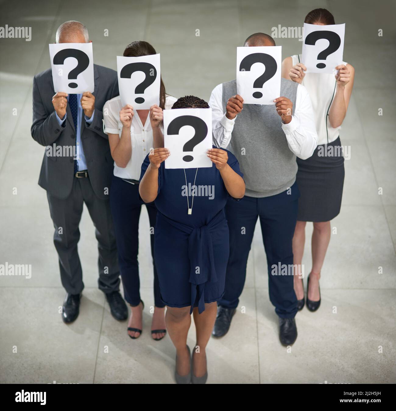 The secretive side of business. High angle shot of a group of ...