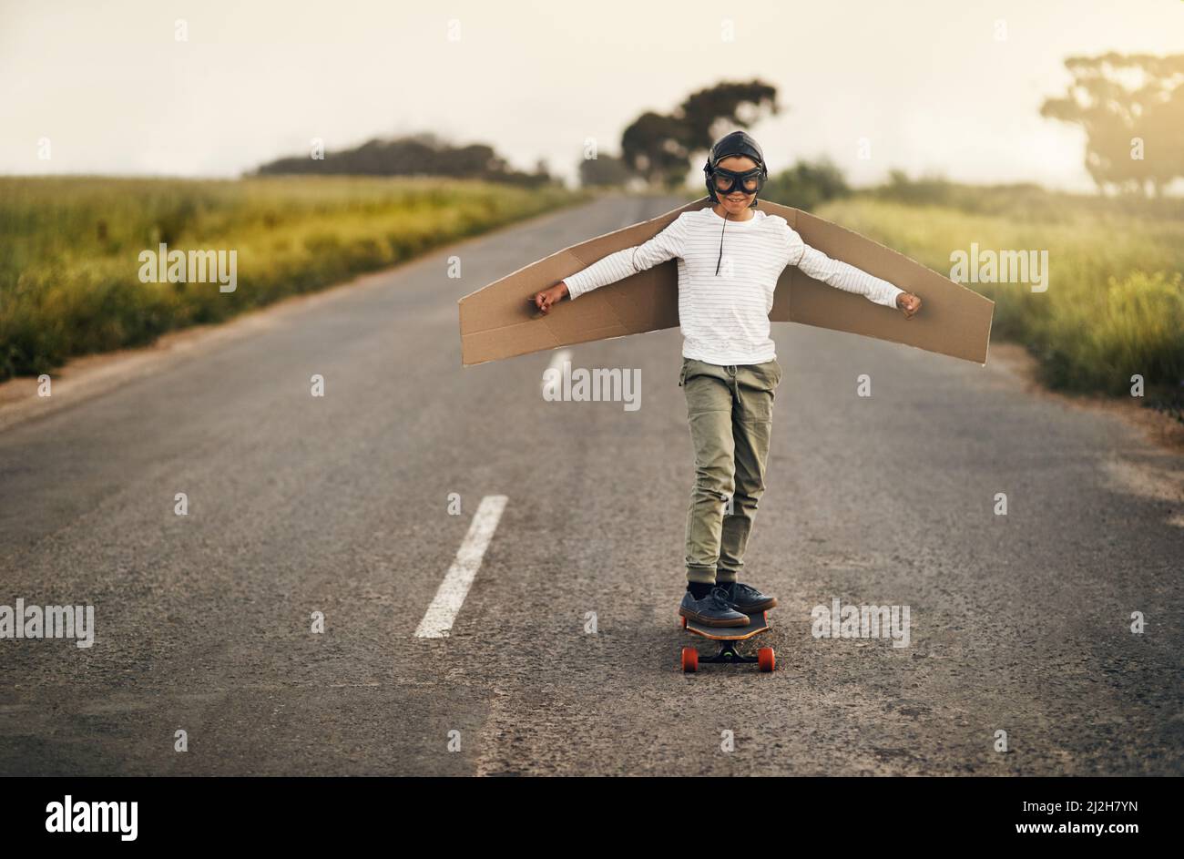 This skater knows how to soar. Shot of a young boy pretending to fly ...