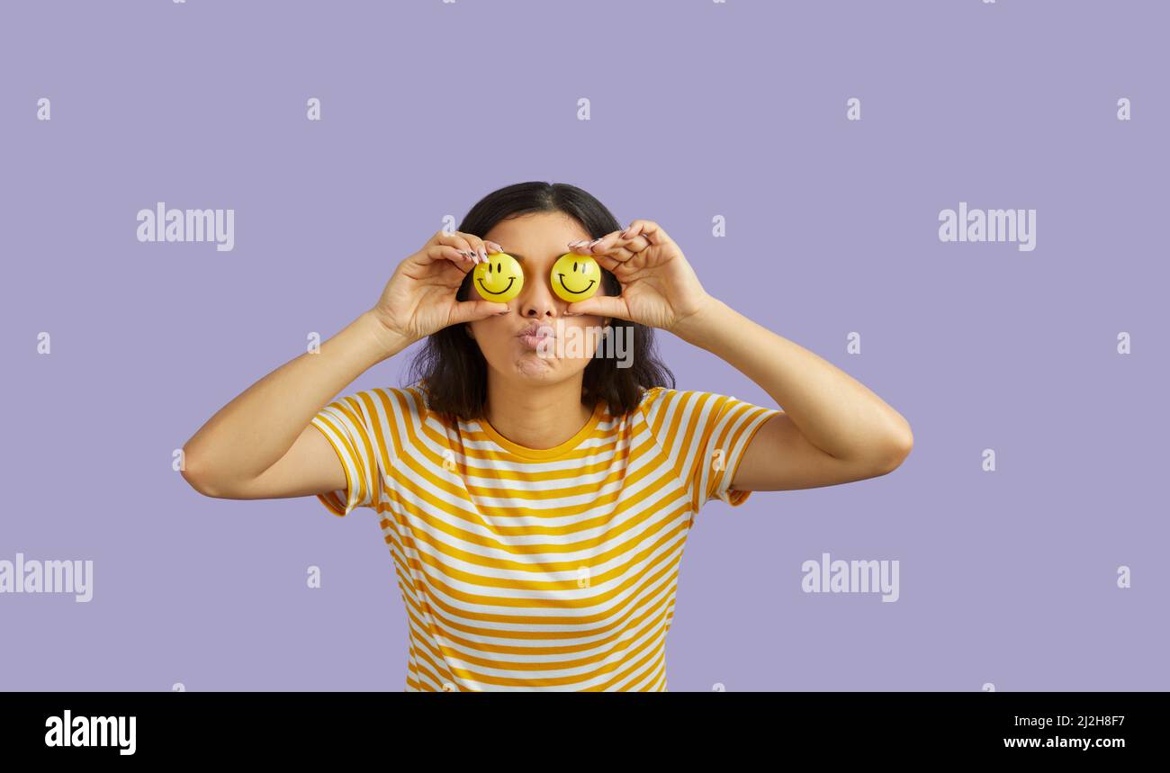 Funny latin girl have fun cover eyes with emojis Stock Photo - Alamy