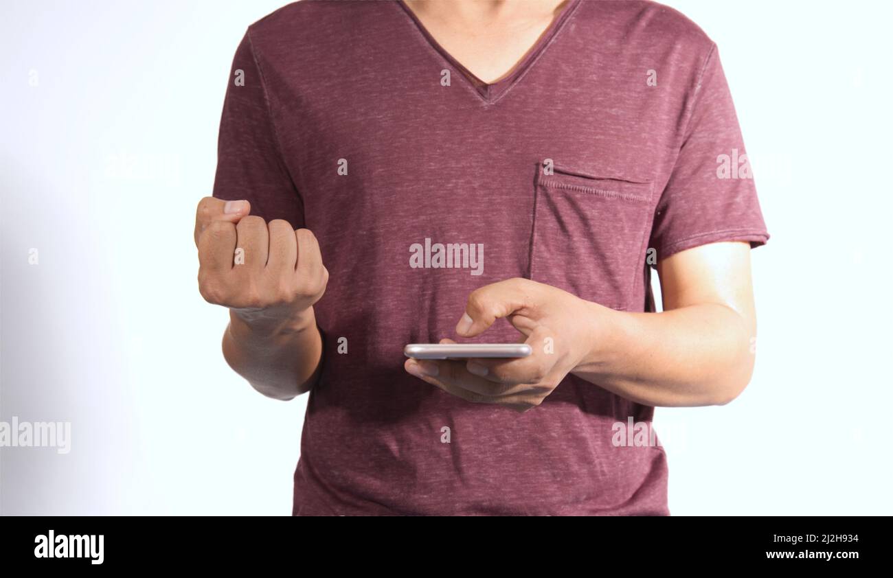 a tall man standing happily using a smartphone On a white isolated ...