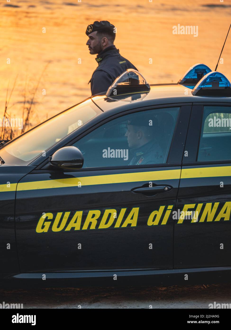 IRS tax evasion police guardia di finanza at sunset in the coast of ...