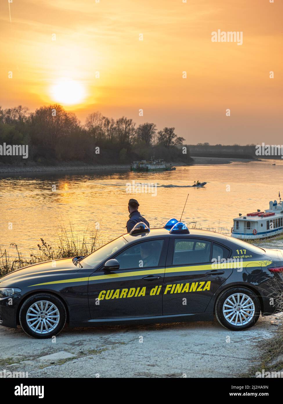 IRS tax evasion police guardia di finanza at sunset in the coast of ...