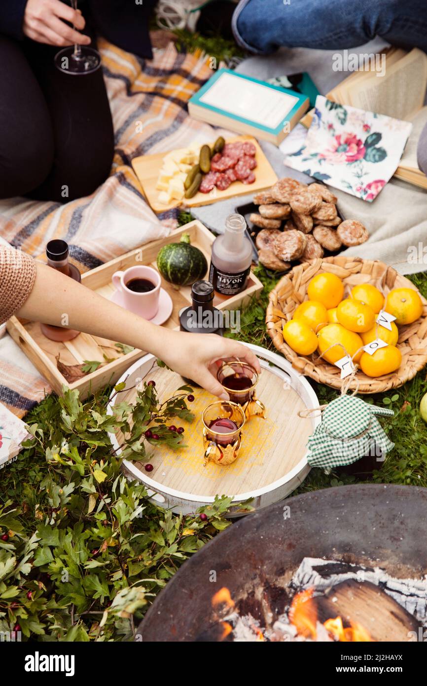 Assorted food at Autumn picnic near fire pit Stock Photo - Alamy