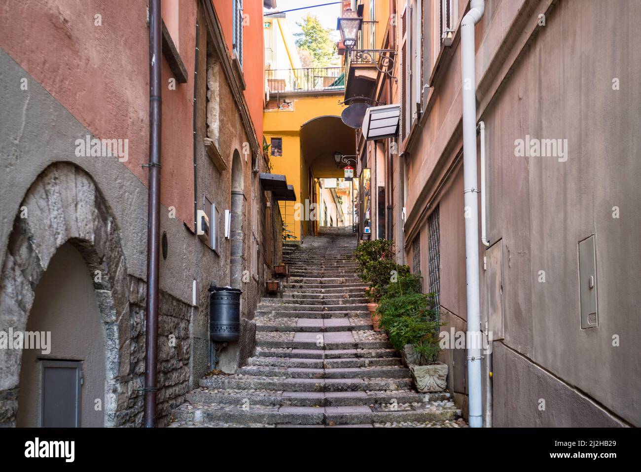 Italy, Bellagio, Narrow alley in old town Stock Photo - Alamy