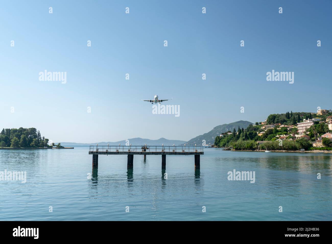 Greece, Corfu island, Airplane flying above sea Stock Photo - Alamy